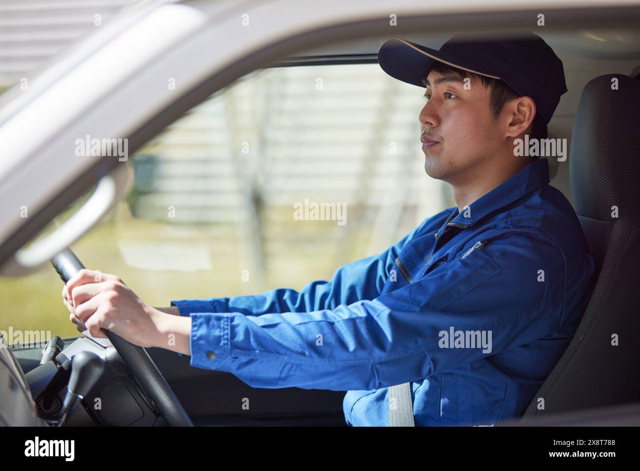 Japanese delivery man driving a car Stock Photo - Alamy