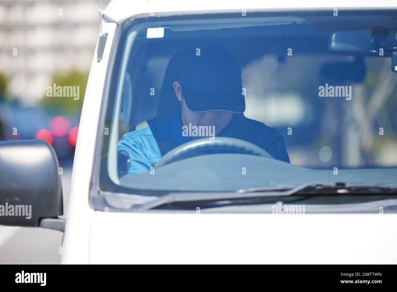 Japanese delivery man sitting in the driver seat Stock Photo - Alamy
