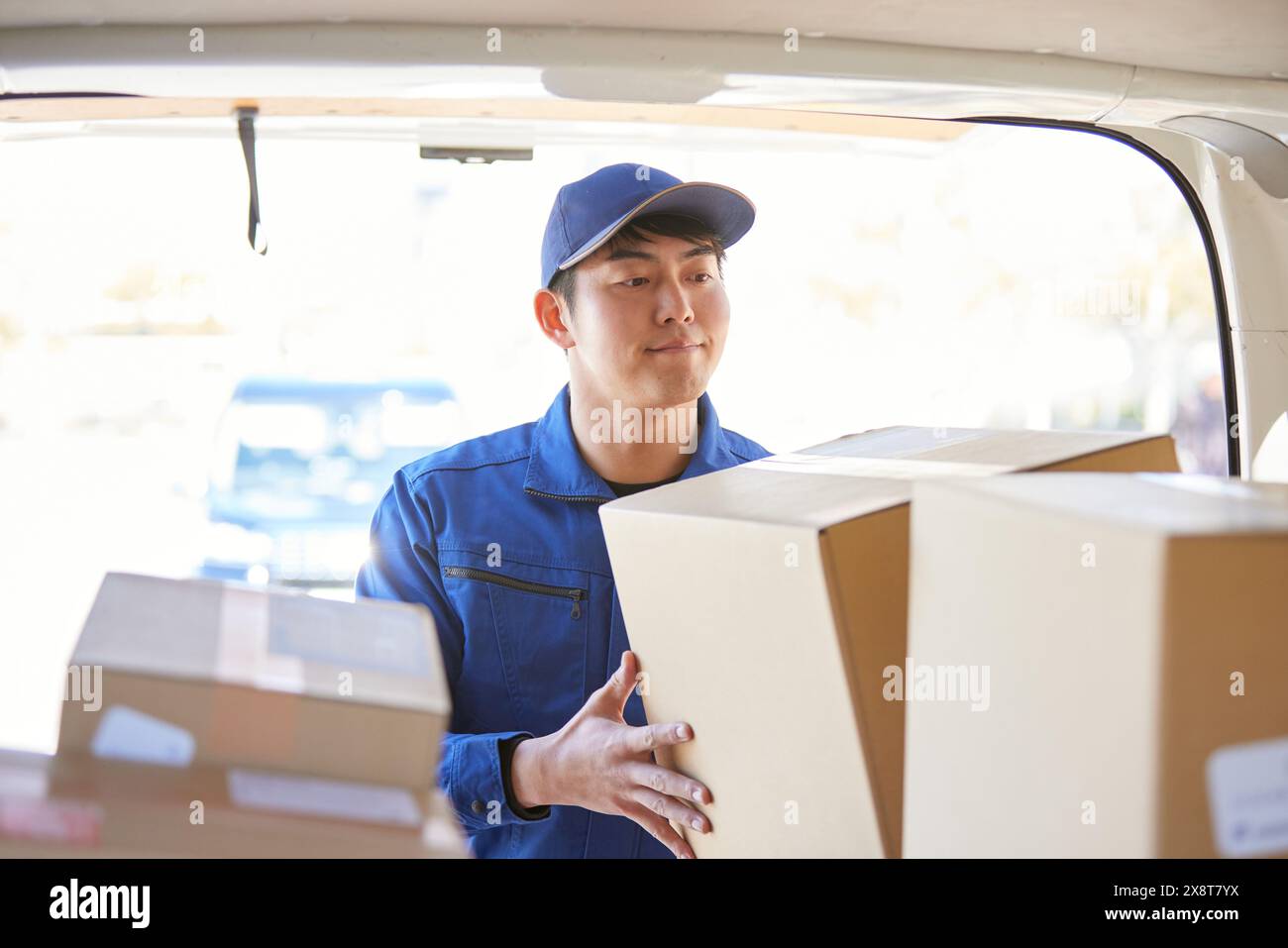 Car carrying japanese man hi-res stock photography and images - Alamy