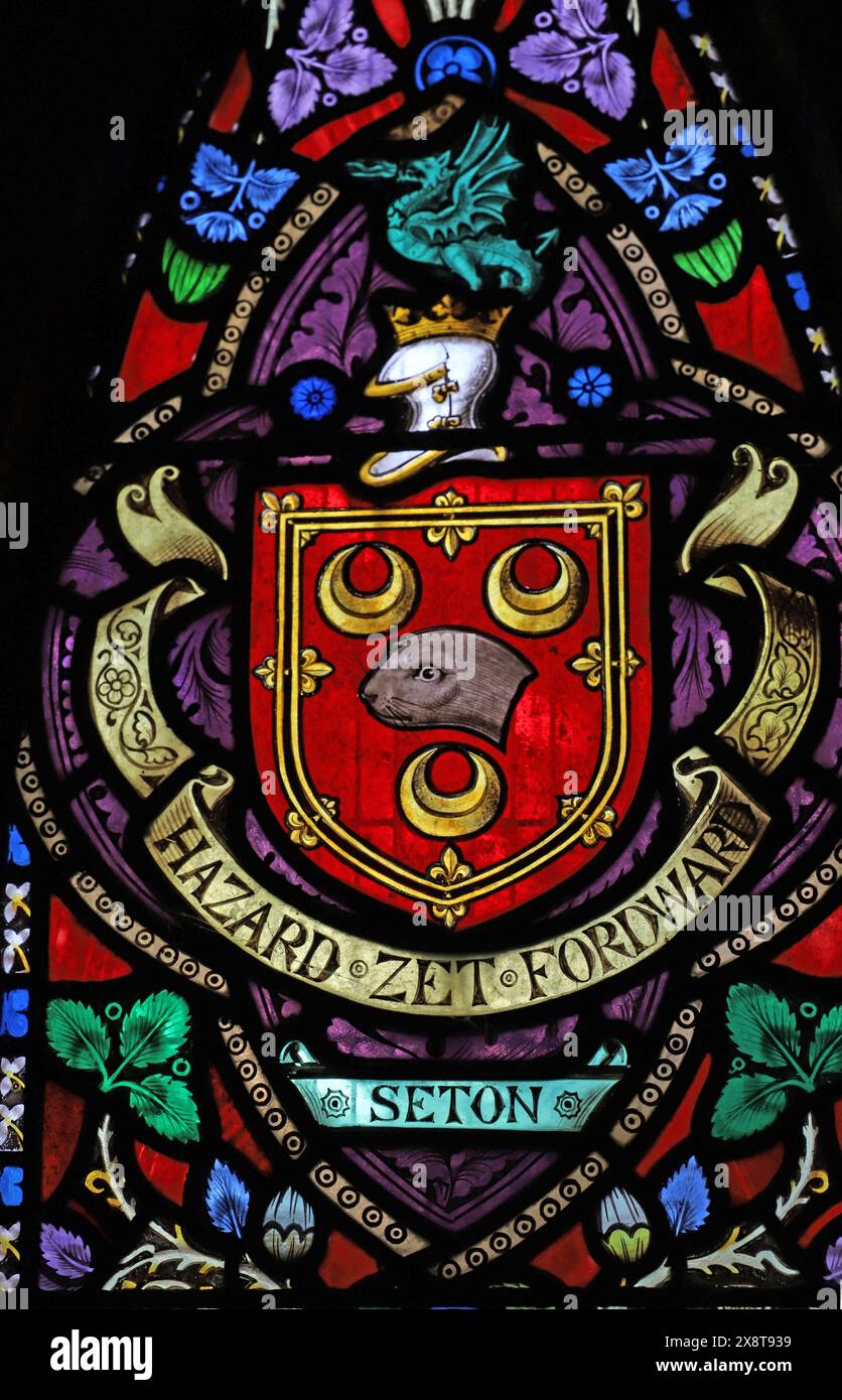 Stained glass window by Alexander Gibbs depicting coats of arms of one ...