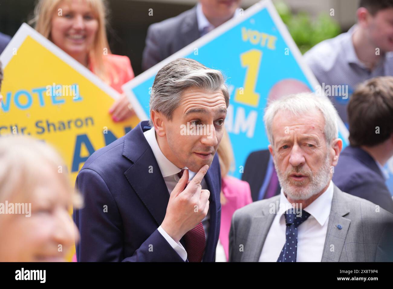 Taoiseach and Fine Gael leader Simon Harris (centre) poses with ...