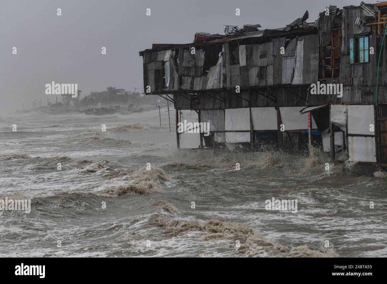 Patuakhali, Bangladesh. 27th May, 2024. Shops seen damaged by the sea ...
