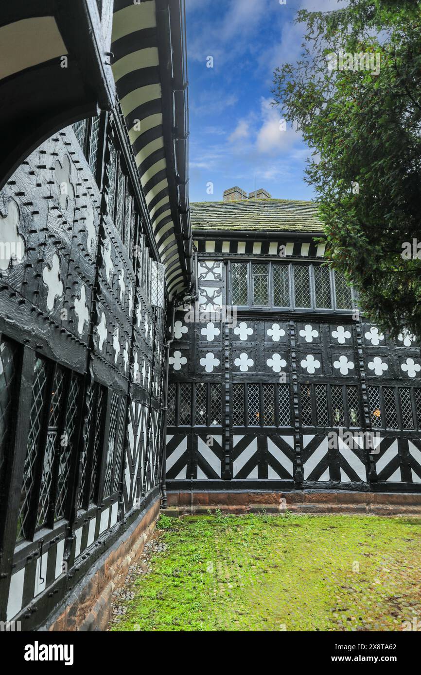 The inner courtyard at Speke Hall, a black and white painted wood ...