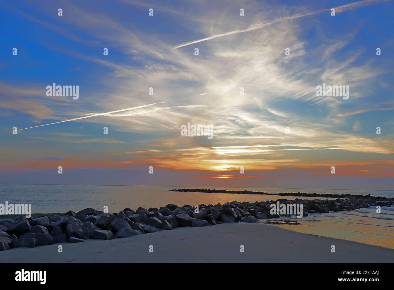 Sun rising over the Atlantic ocean with a dramatic early morning sky ...