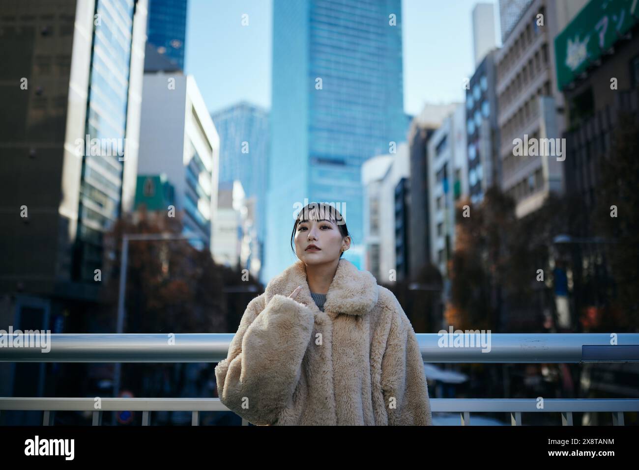 Young Japanese woman portrait in downtown Tokyo Stock Photo - Alamy