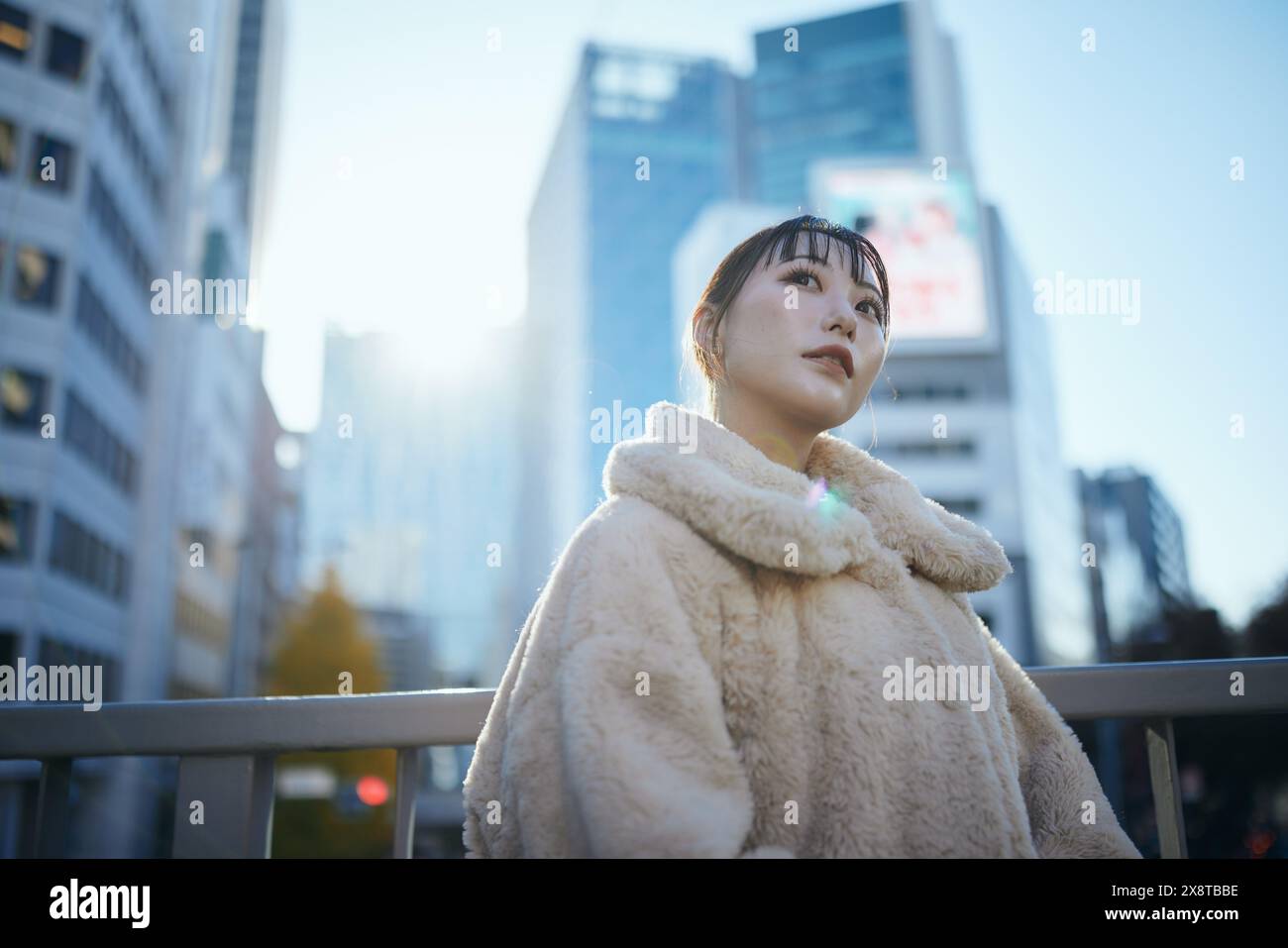 Young Japanese woman portrait in downtown Tokyo Stock Photo - Alamy