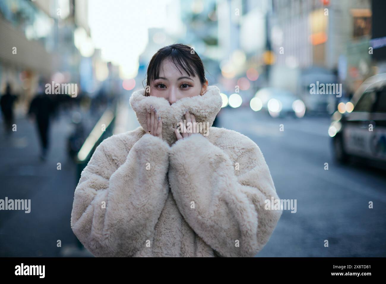 Young Japanese woman portrait in downtown Tokyo Stock Photo - Alamy