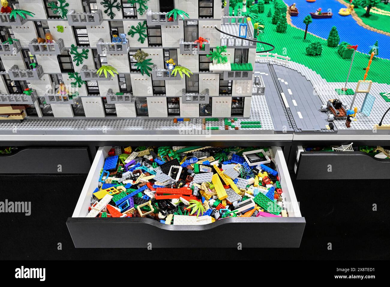 Drawer toy building blocks and Lego apartment block with surroundings ...