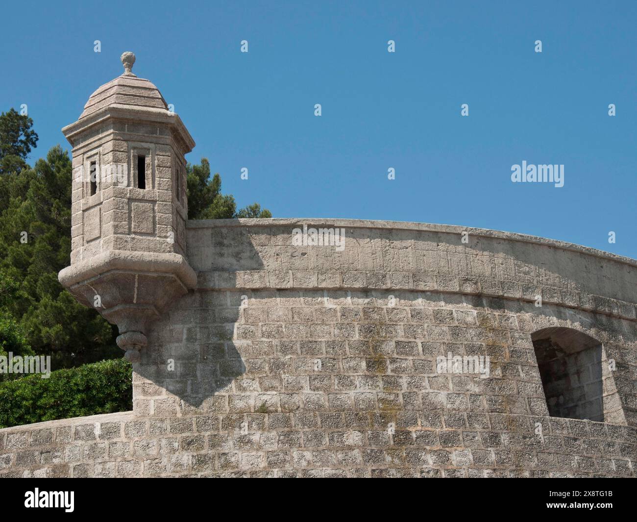 A detailed historical stone tower on an old fortress wall under a ...