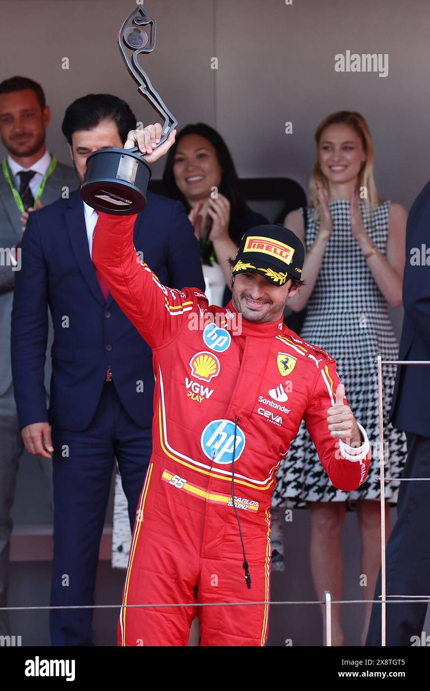Carlos Sainz of Scuderia Ferrari celebrates with the trophy third place ...