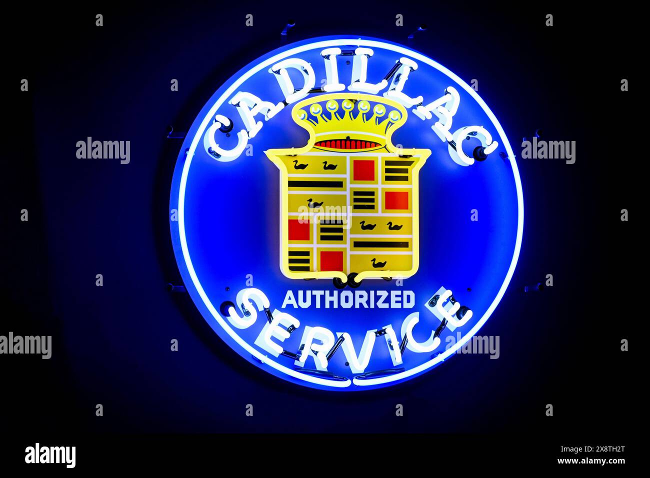 Illuminated advertising Cadillac Service Stock Photo - Alamy