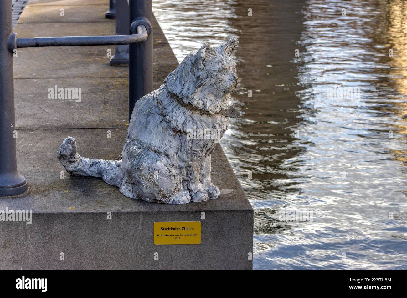 Cat sculpture City Cat Chicco, at the water Memminger Ach and in the background the Evangelical ...