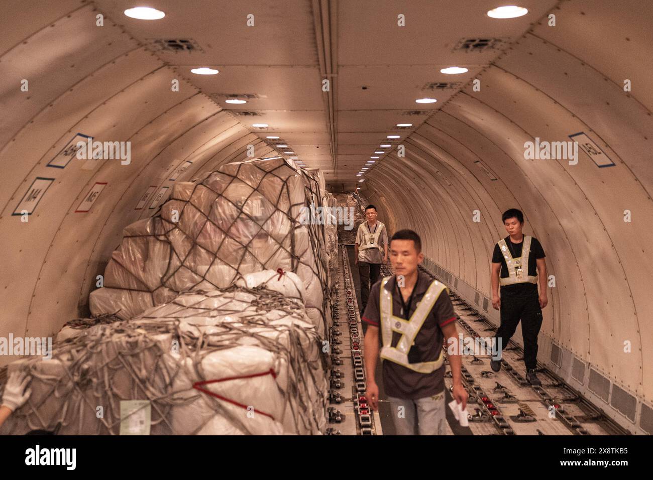 Staff members of SF airlines load the cargo onto a SF cargo aircraft at ...