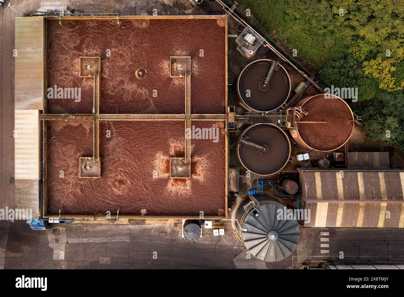 Aerial view directly above large storage silos rendering fats, bone and ... Aerial view directly above large storage silos rendering fats, bone and ...