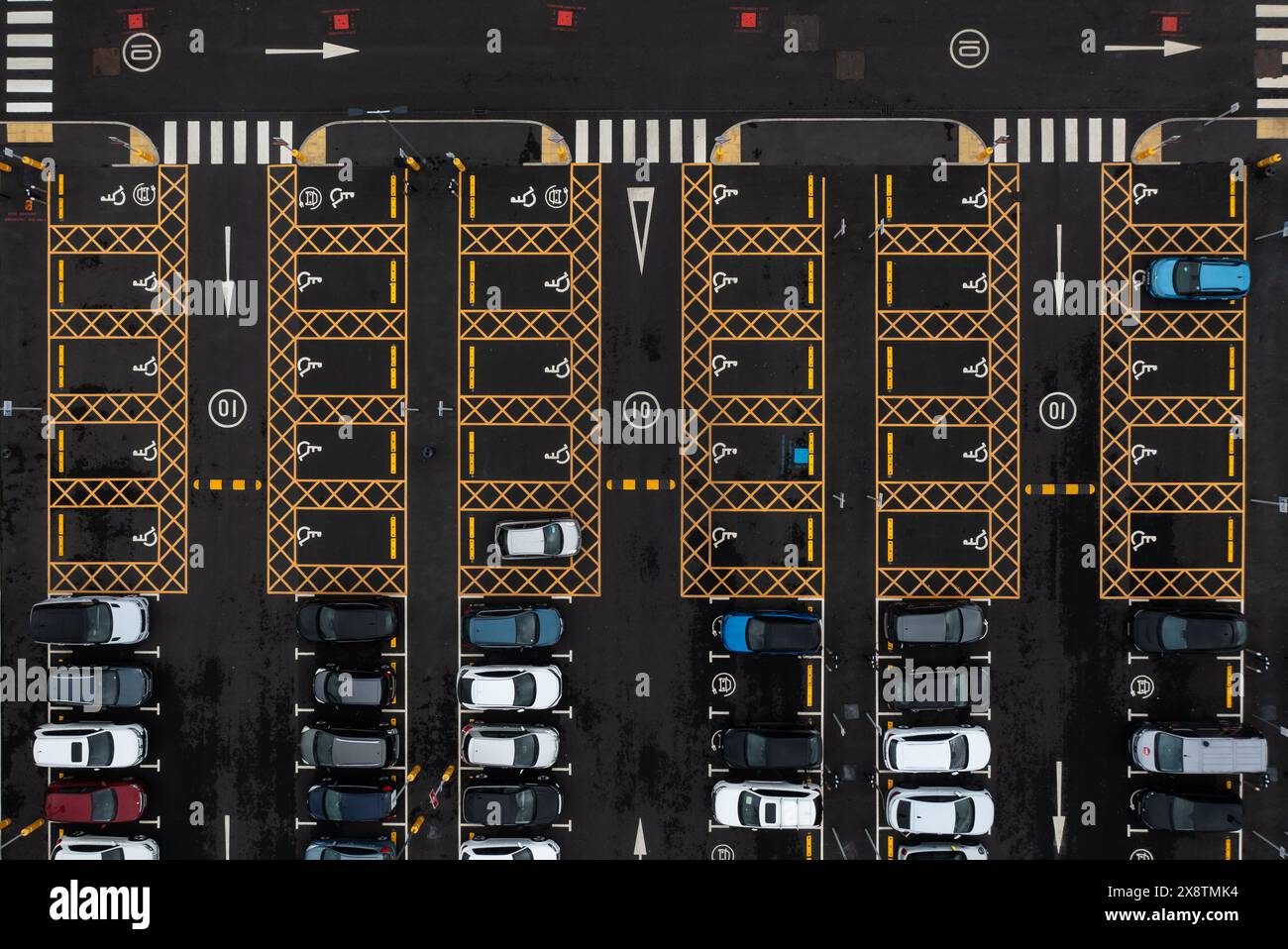 Aerial view directly above a large parking lot with car parking spaces ... Aerial view directly above a large parking lot with car parking spaces ...