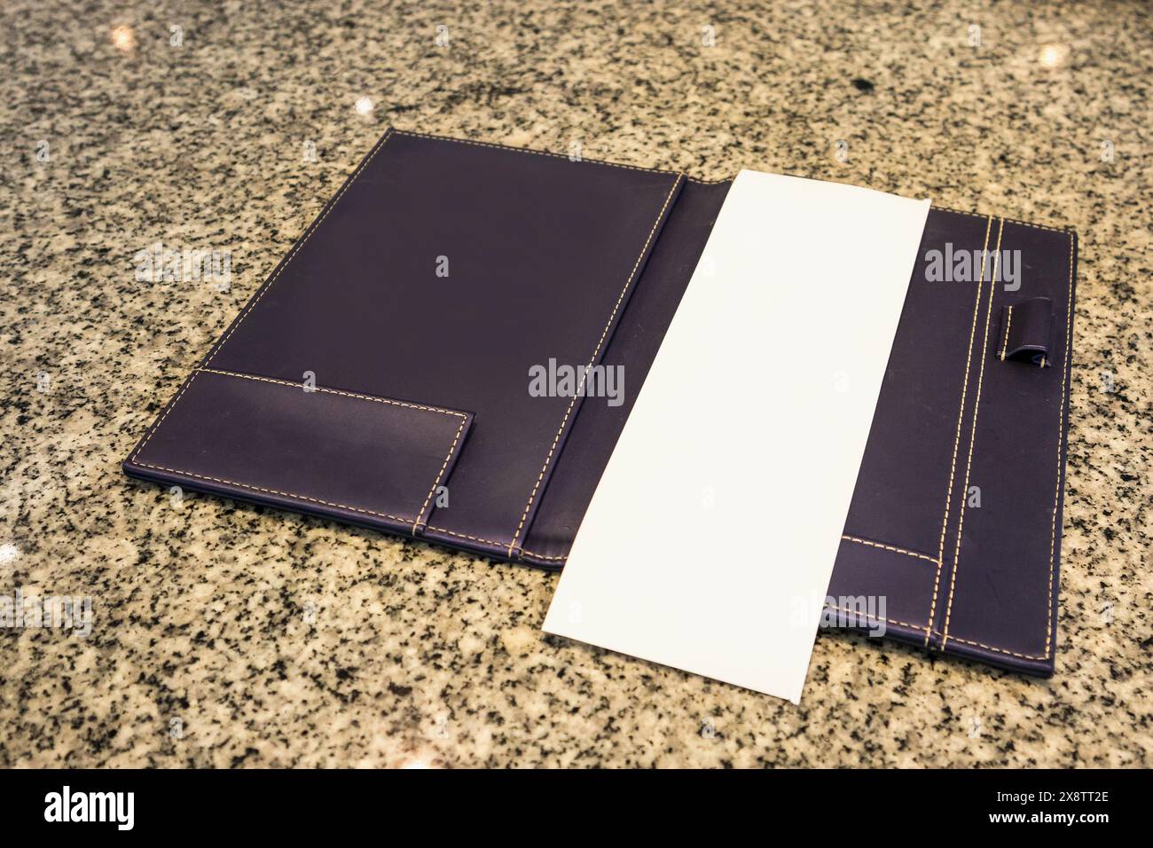 Blank empty white paper in restaurant payment billing receipt folder on ...