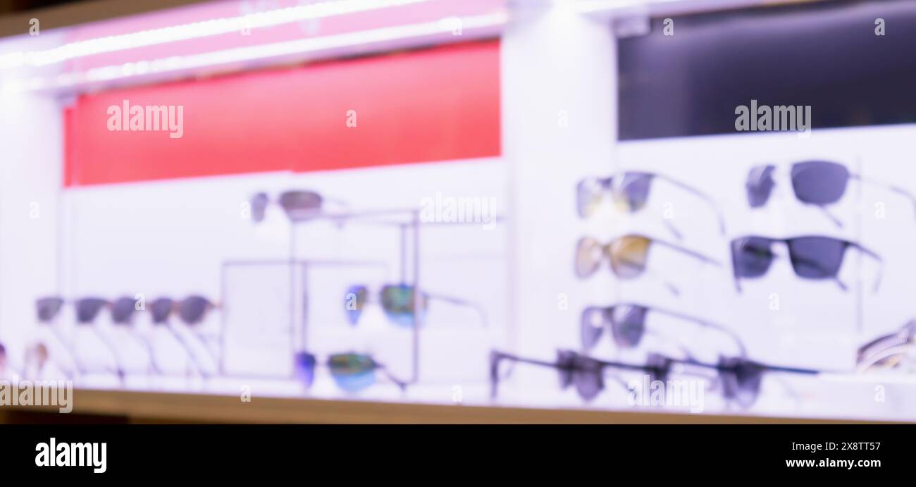 Blur Sunglasses on display shelves in glasses store background Stock ...