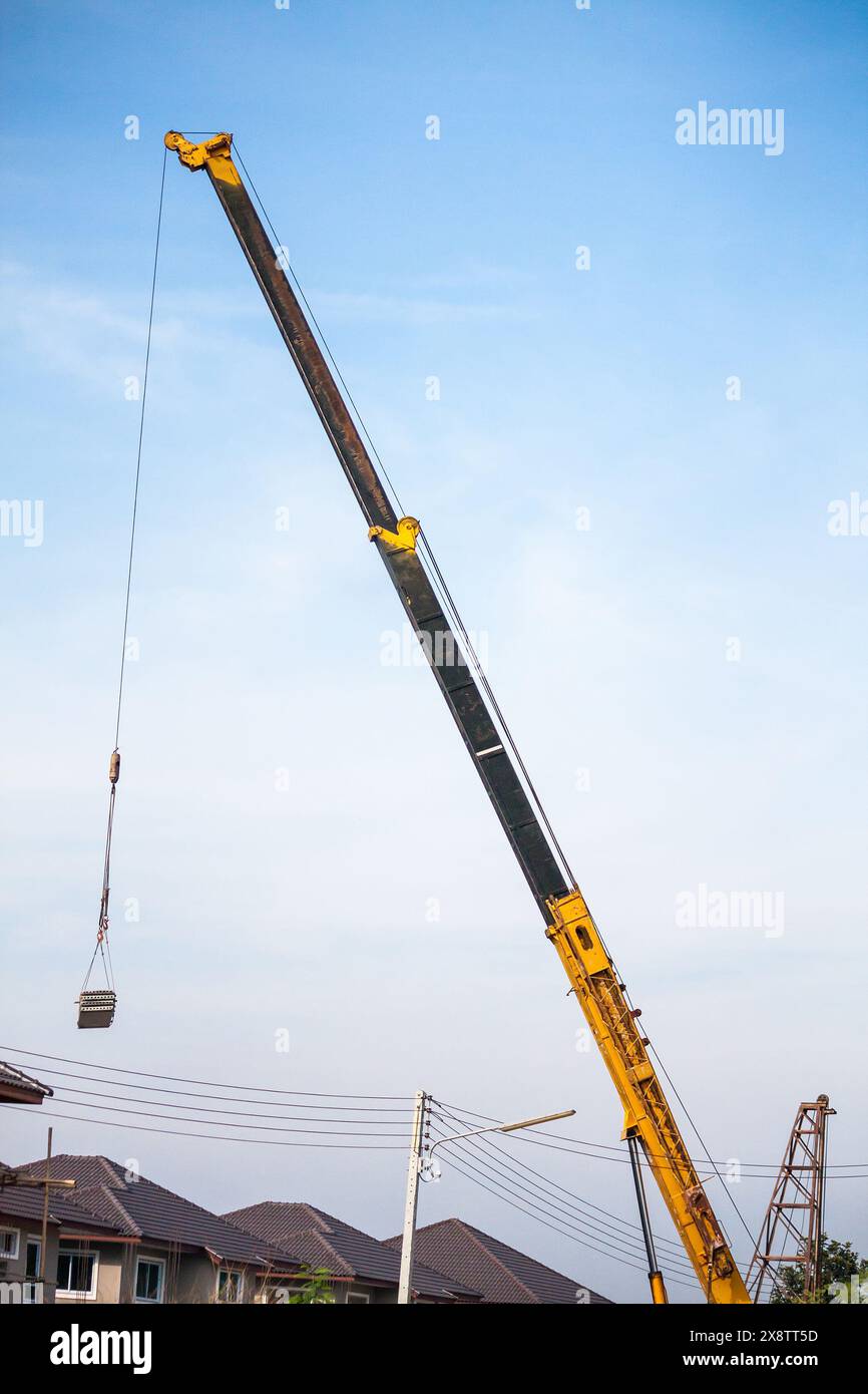 yellow telescopic arms of mobile construction crane truck lifting ...