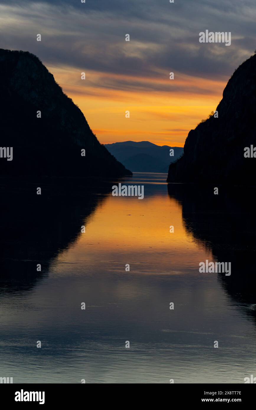 Mesmerizing sunset casts vibrant hues over the tranquil waters of the ...