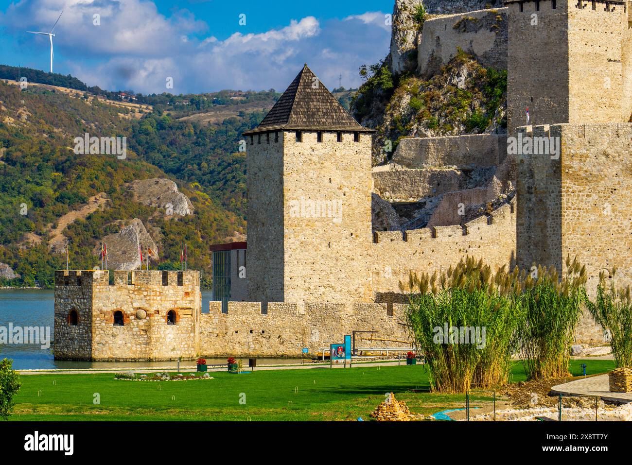 Historic Golubac Fortress stands proudly over the serene Danube River ...