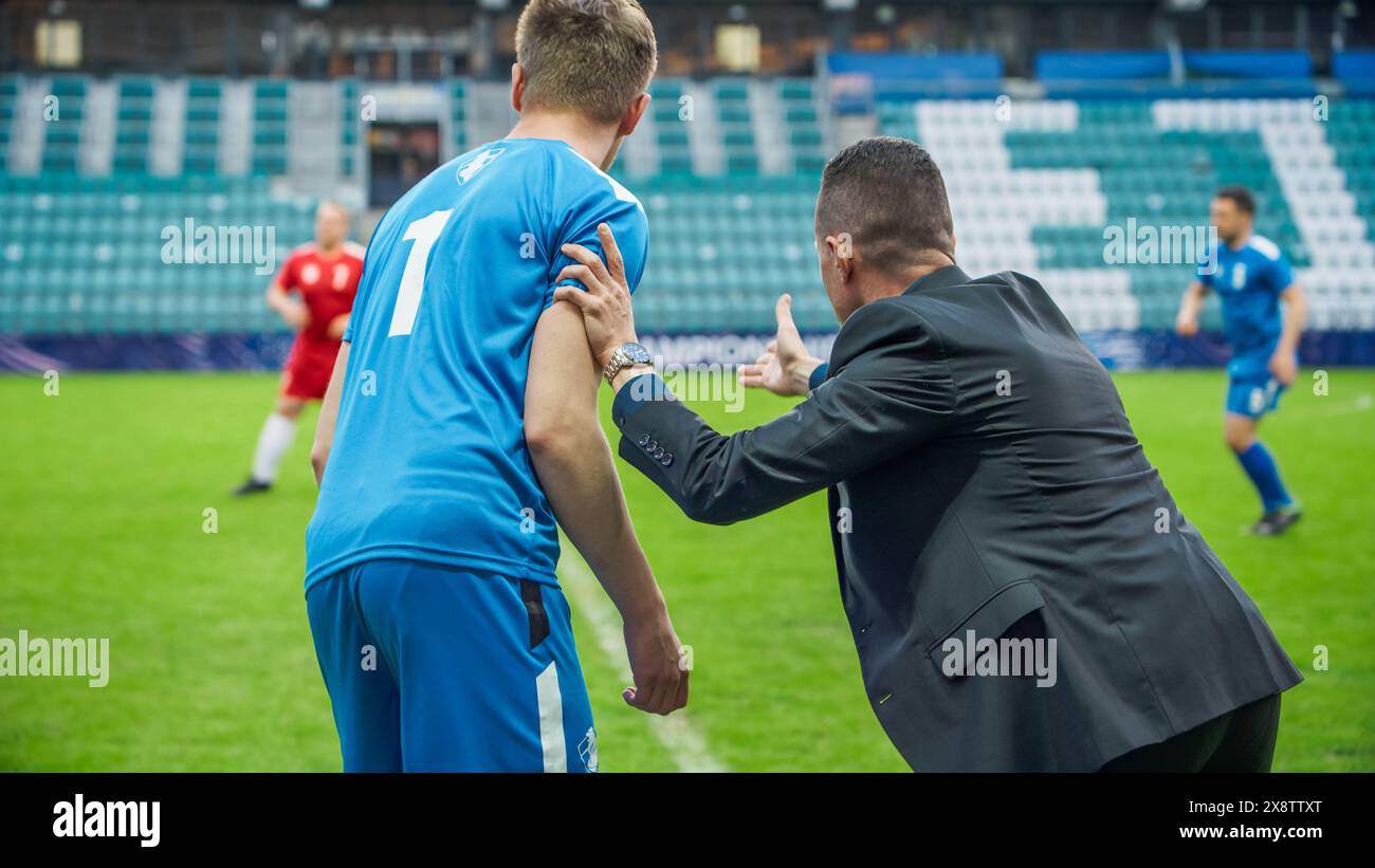 Soccer Football Match Championship on Stadium, Coach Does Player Substitute. Professional Teams ...