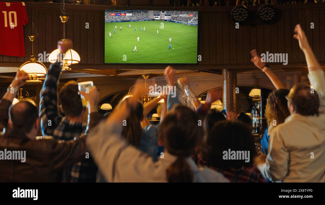 Group of Soccer Fans Watching a Live Football Match in a Sports Bar ...