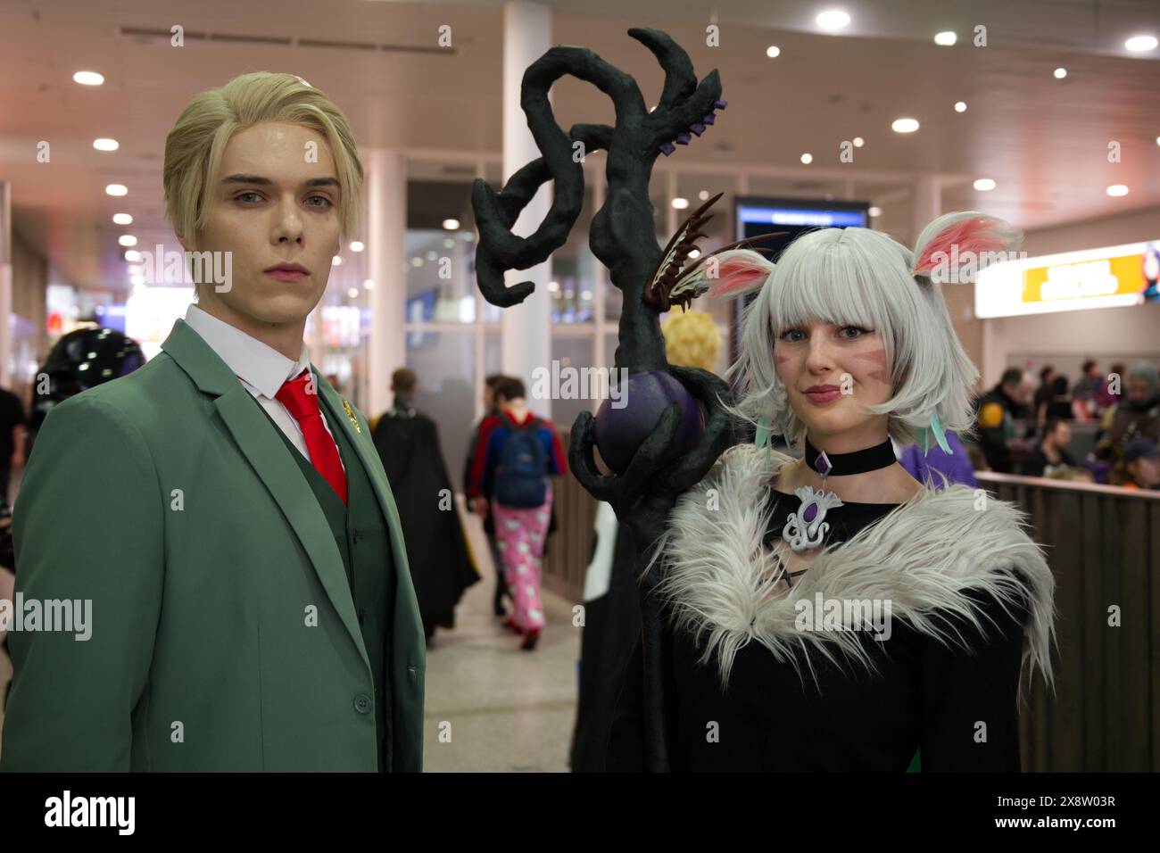A male and female Cosplayer posing for photos at MCM Comic Con Stock ...