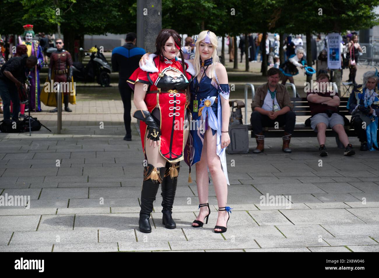 Two female cosplayers posing for photographs at MCM Comic Con Stock ...