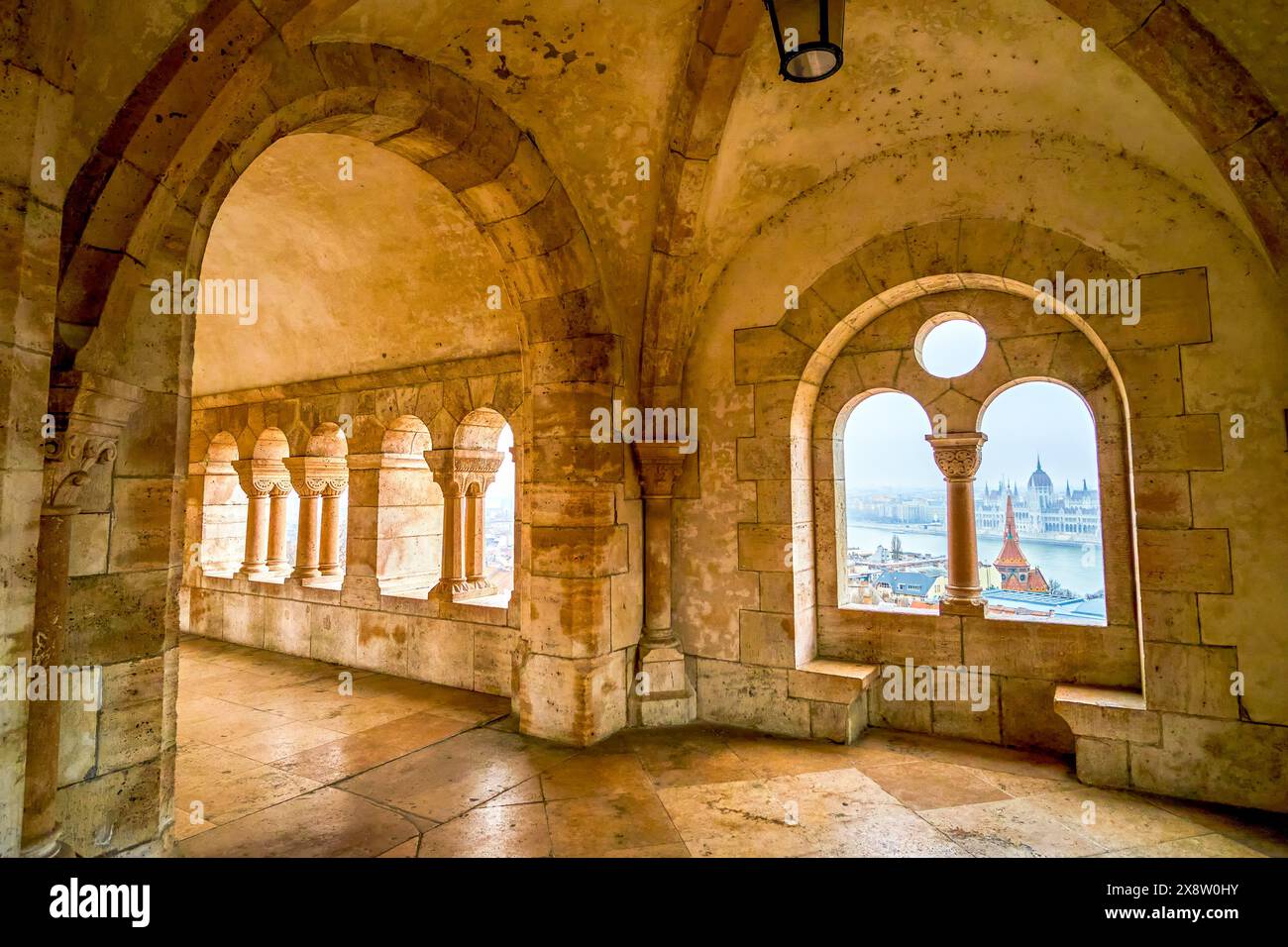 Arched gallery of stone Fisherman's Bastion with scenic windowframes ...