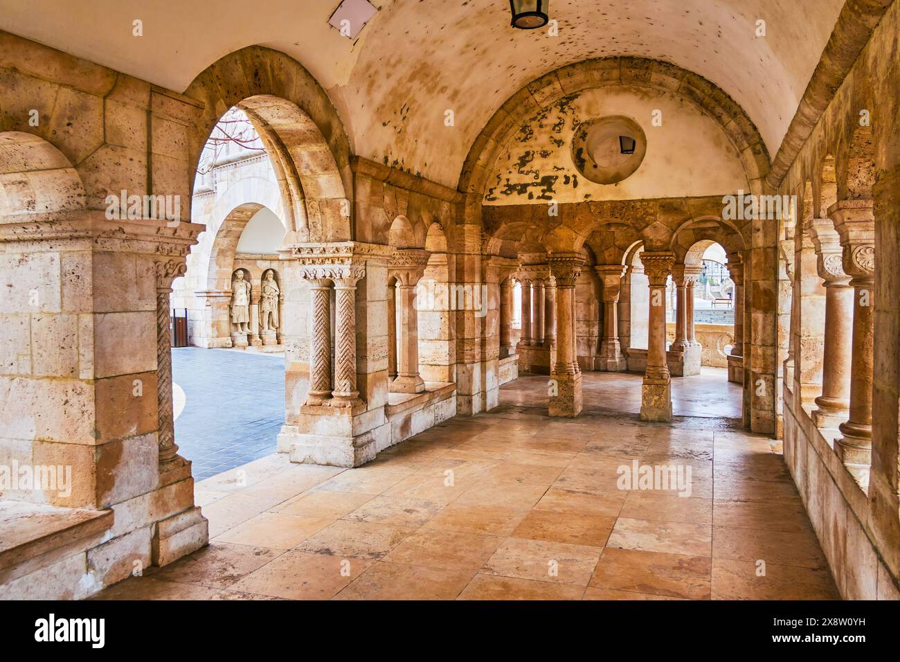 Arched gallery of stone Fisherman's Bastion with scenic windowframes ...