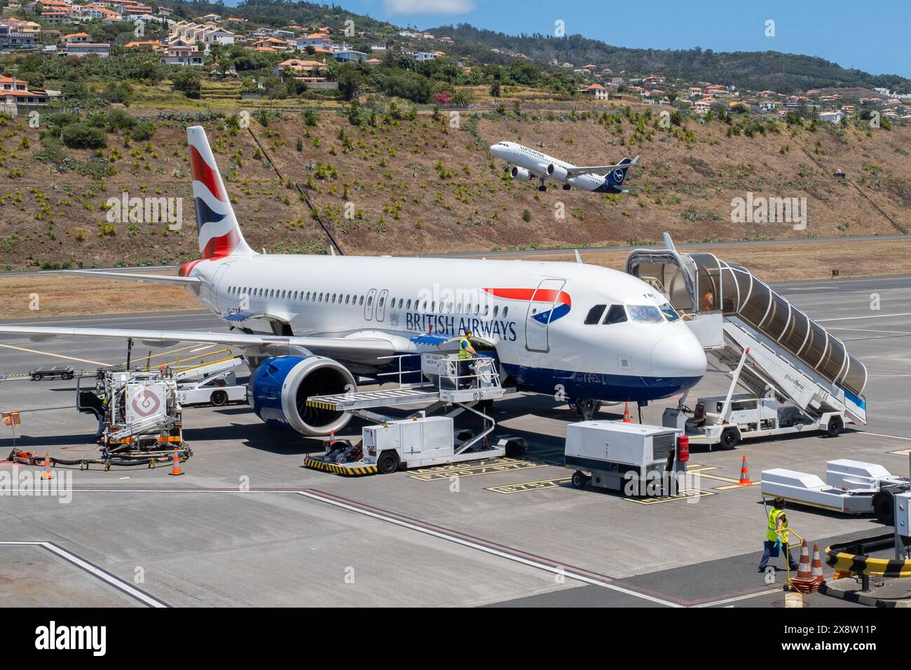 British Airway A320 aircraft on stand at Madeira Airport with departing ...