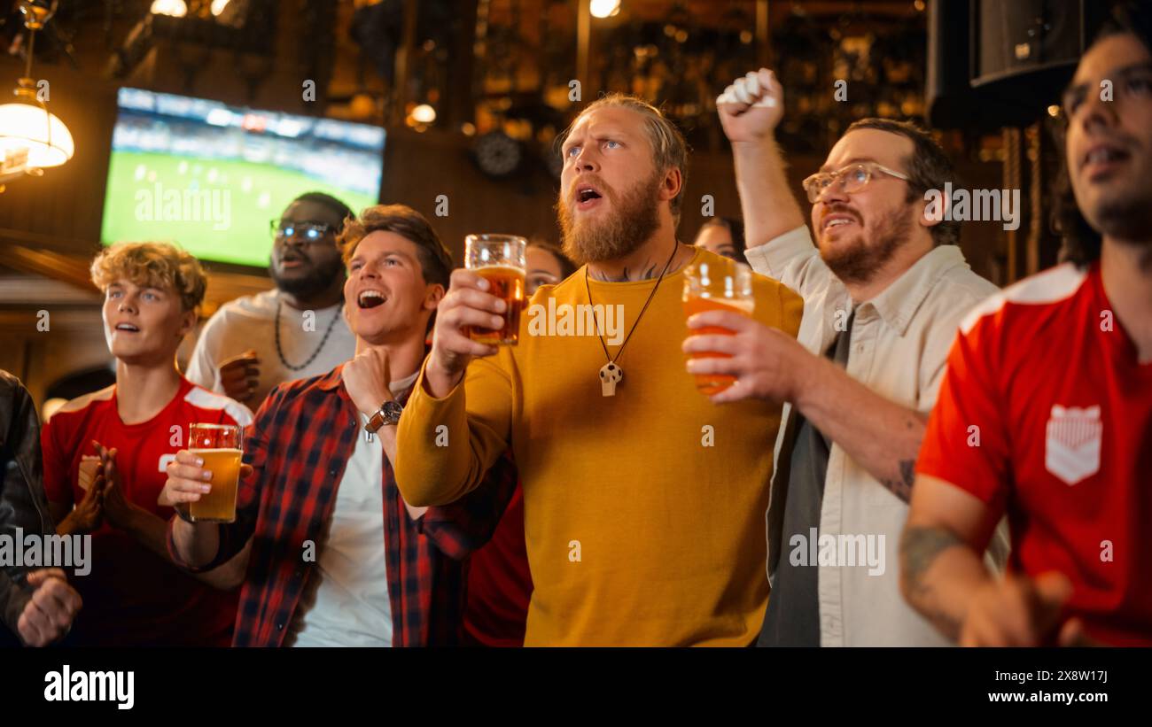 Men in bar celebrating successful hi-res stock photography and images ...