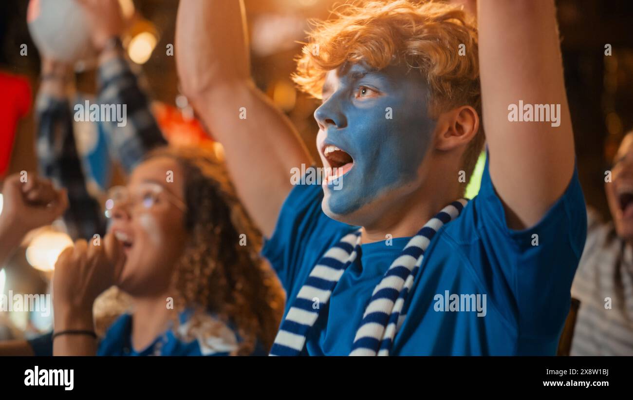 Diverse Group of Soccer Fans with Colored Faces Watching a Live ...