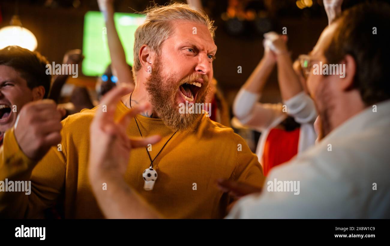 Excited Soccer Club Members Cheering for Their Team in a Pub ...