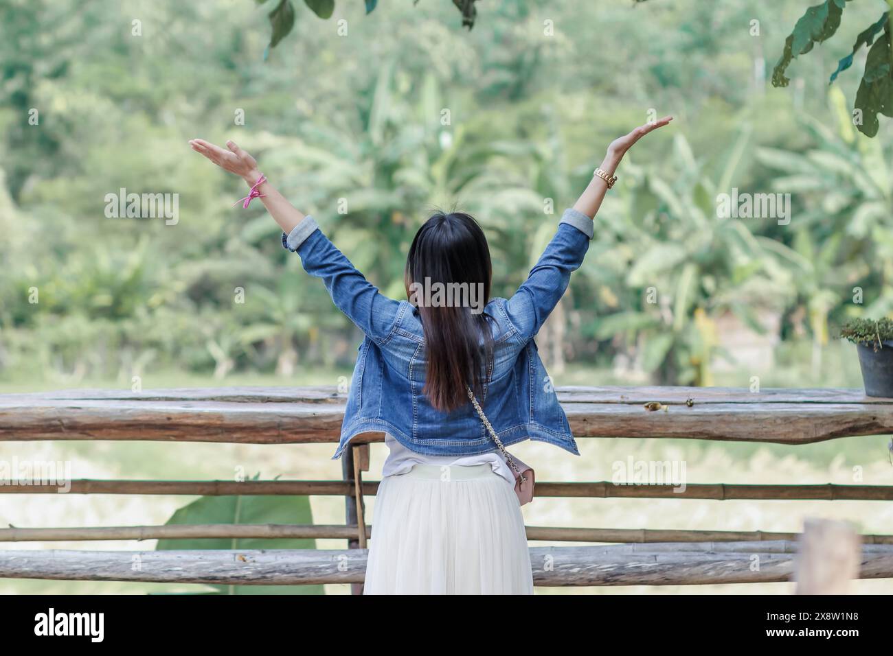 woman raised her hands above her head to ask for mercy from God in ...