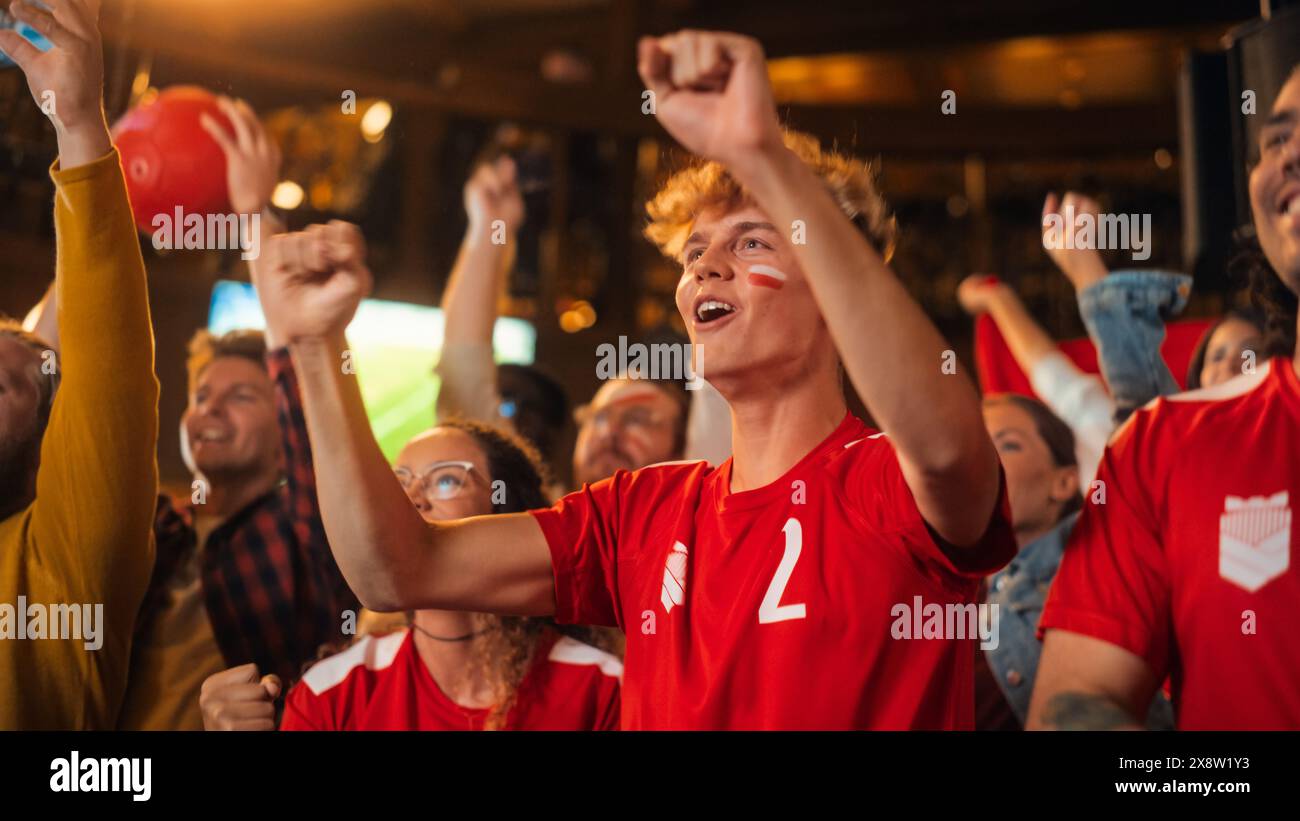 Group of Soccer Fans in Red Clothes Cheering, Screaming, Raising Hands ...