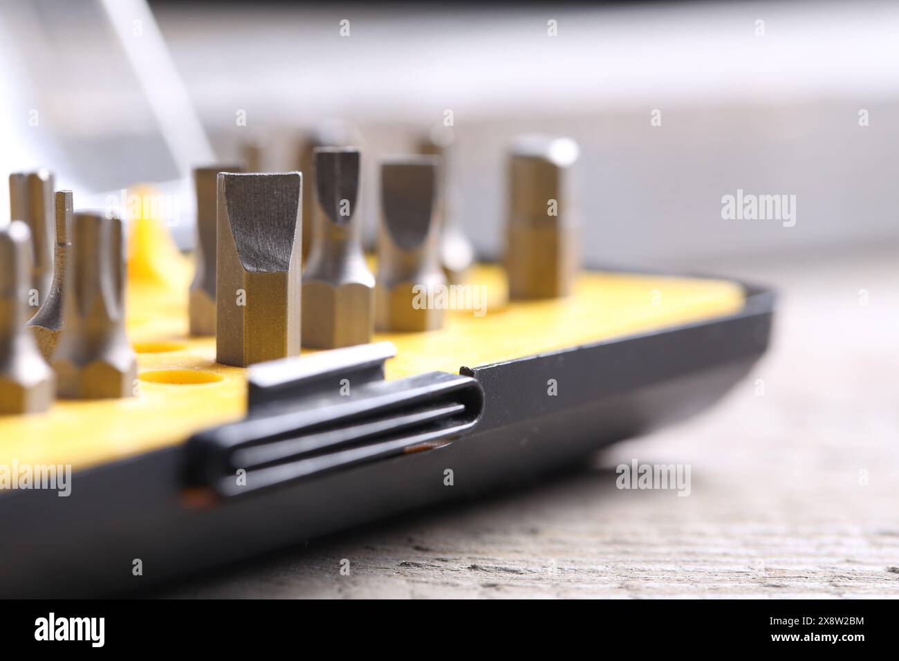 Screwdriver bit set on blurred background, closeup Stock Photo - Alamy