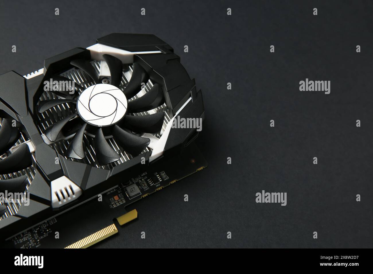 Computer graphics card on black background, closeup. Space for text ...