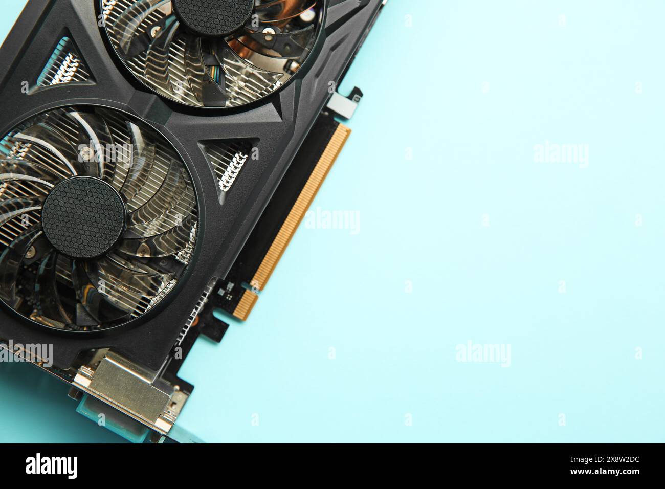 One graphics card on light blue background, top view. Space for text ...