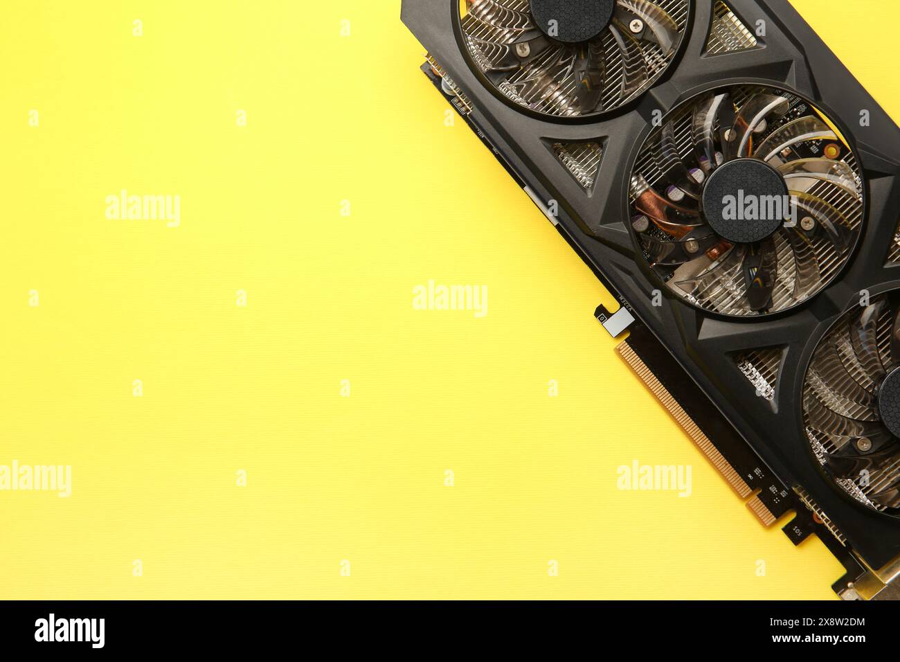 One graphics card on yellow background, top view. Space for text Stock ...