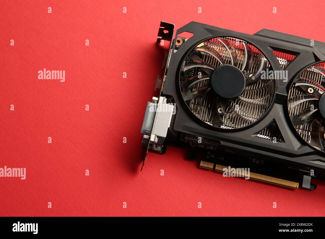 One graphics card on red background, top view. Space for text Stock ...
