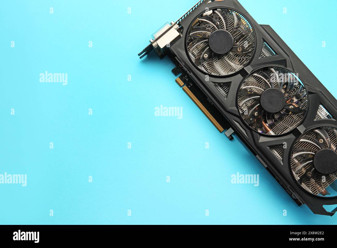 One graphics card on light blue background, top view. Space for text ...