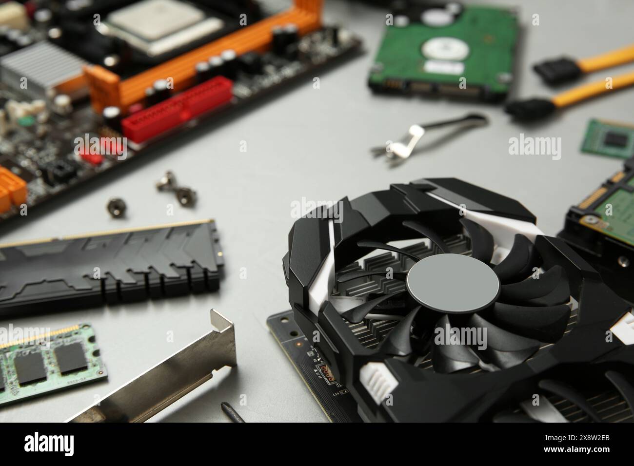 Graphics card and other computer hardware on gray background, closeup ...