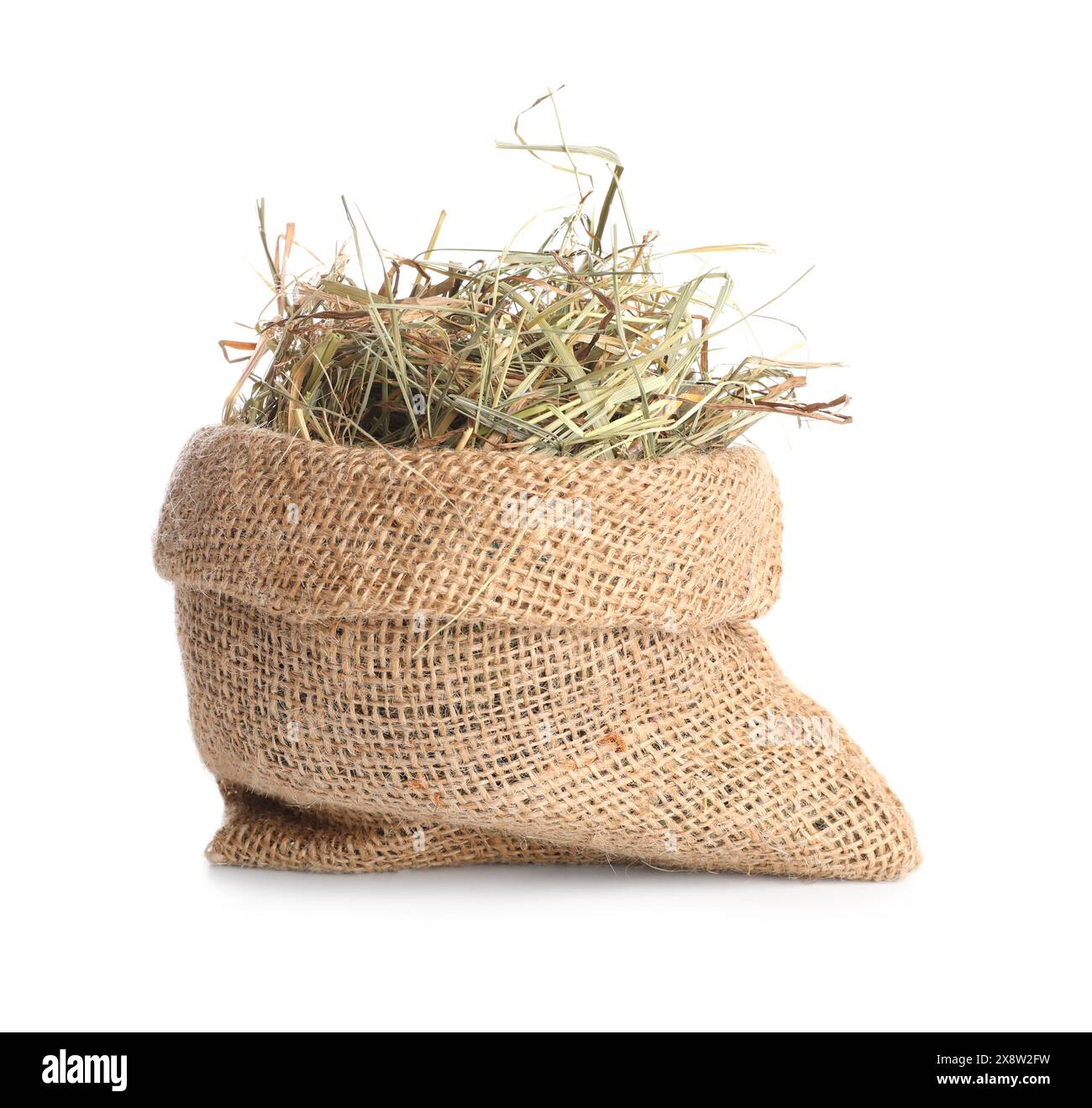 Dried hay in burlap sack isolated on white Stock Photo - Alamy