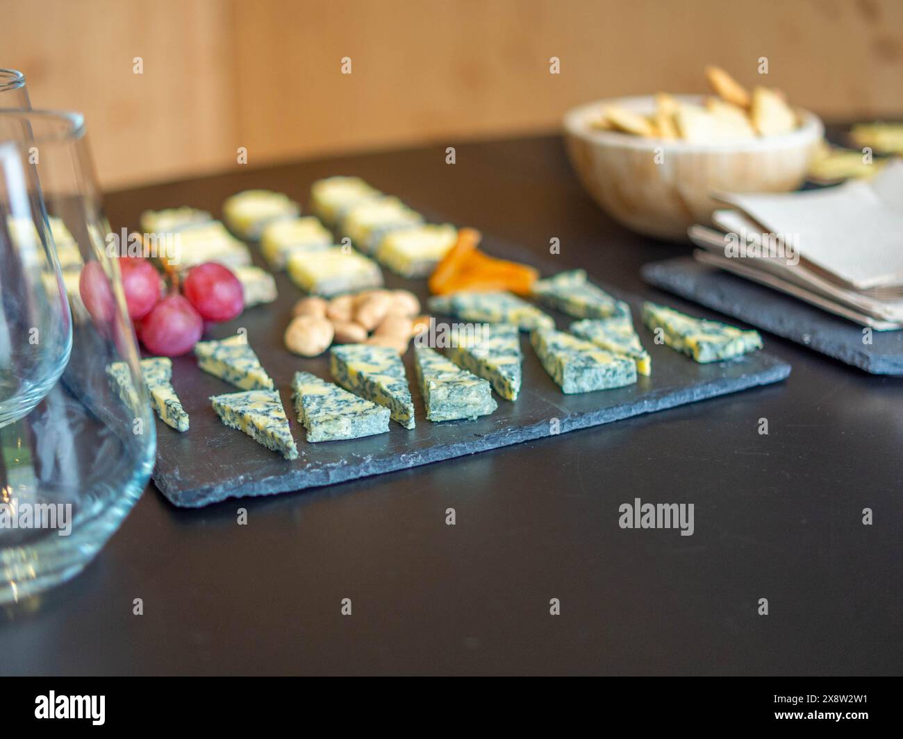 Tasting of white wine and blue cheese Stock Photo - Alamy