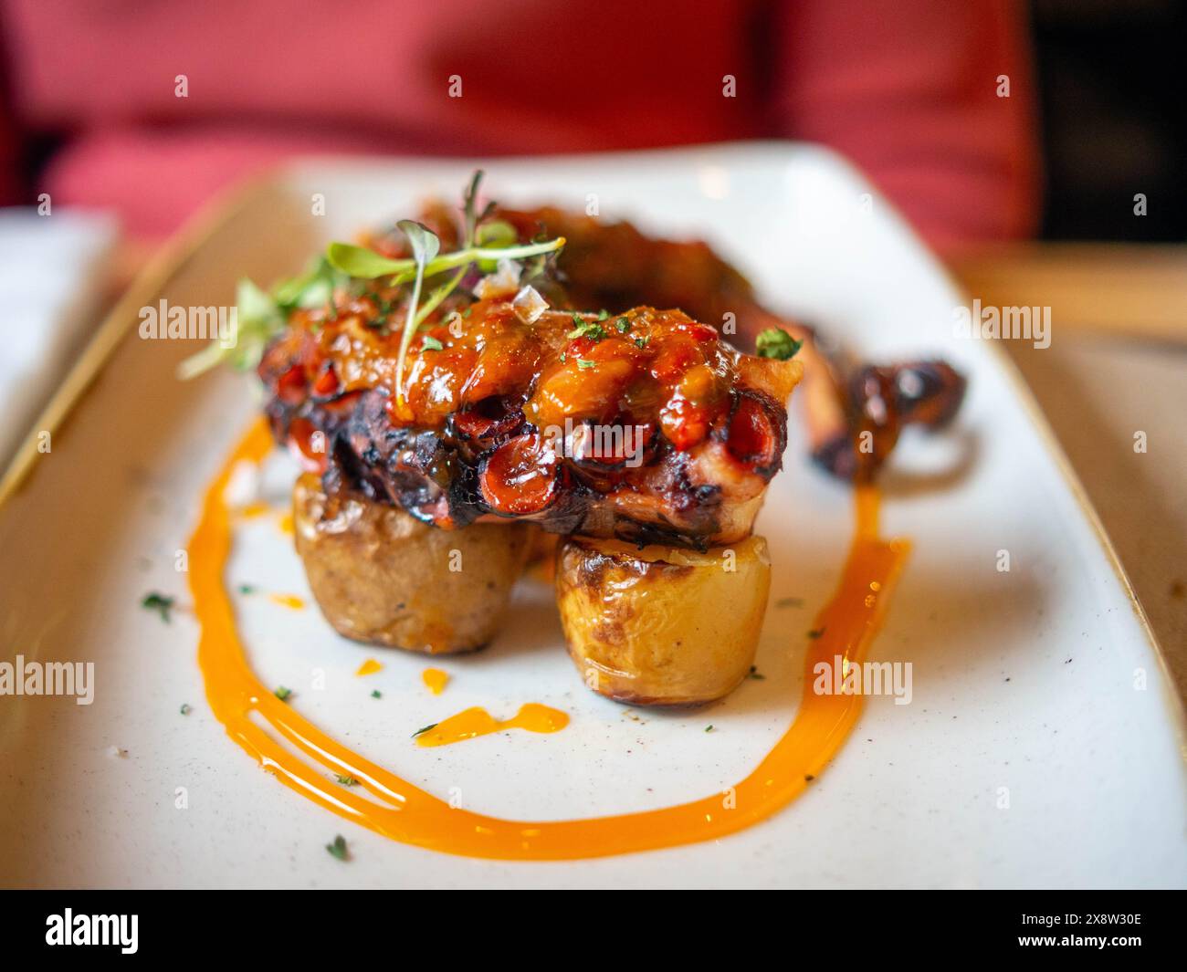 Gourmet octopus and potatoes dish Stock Photo - Alamy
