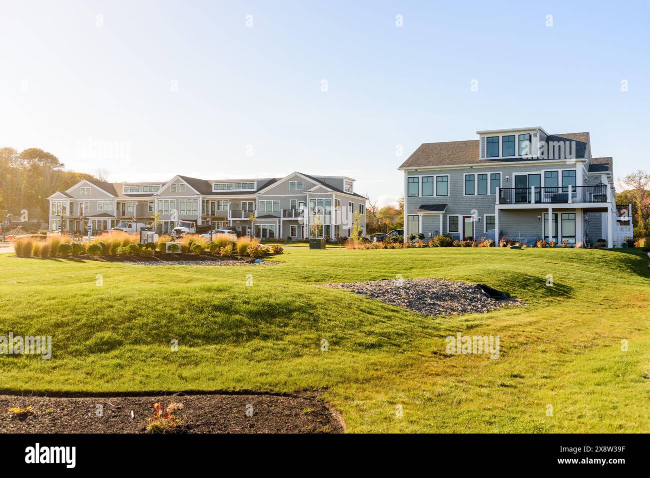 Row houses under construction in a housing development at sunset in ...
