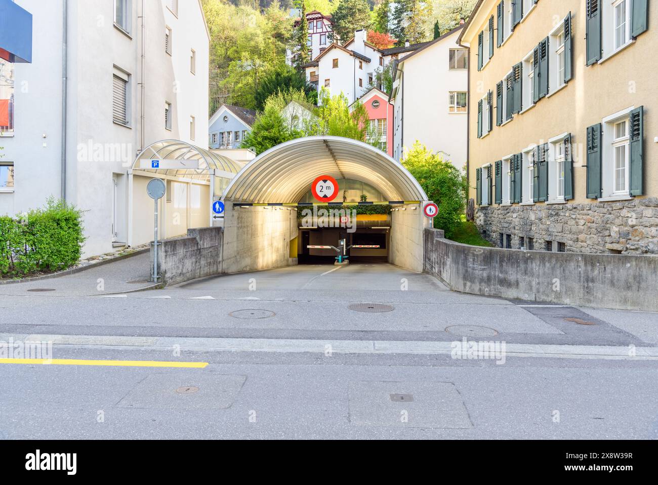 Entrance of an underground parking garage in a city centre at sunset in ...