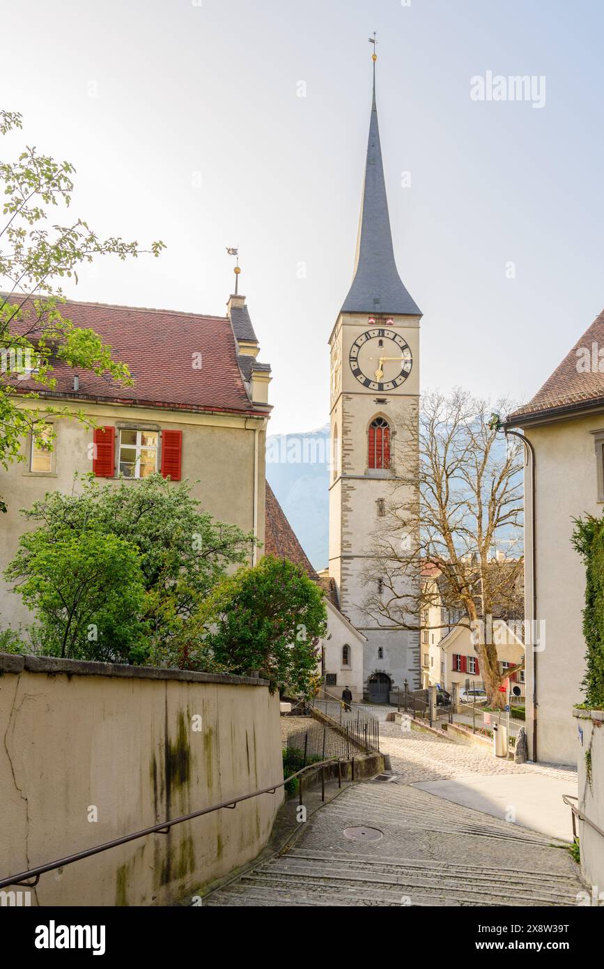 Large staircase beetween high walls leading down to a cobled street ...