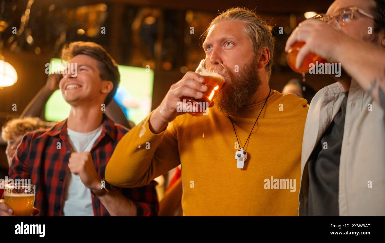 Men in bar celebrating successful hi-res stock photography and images ...